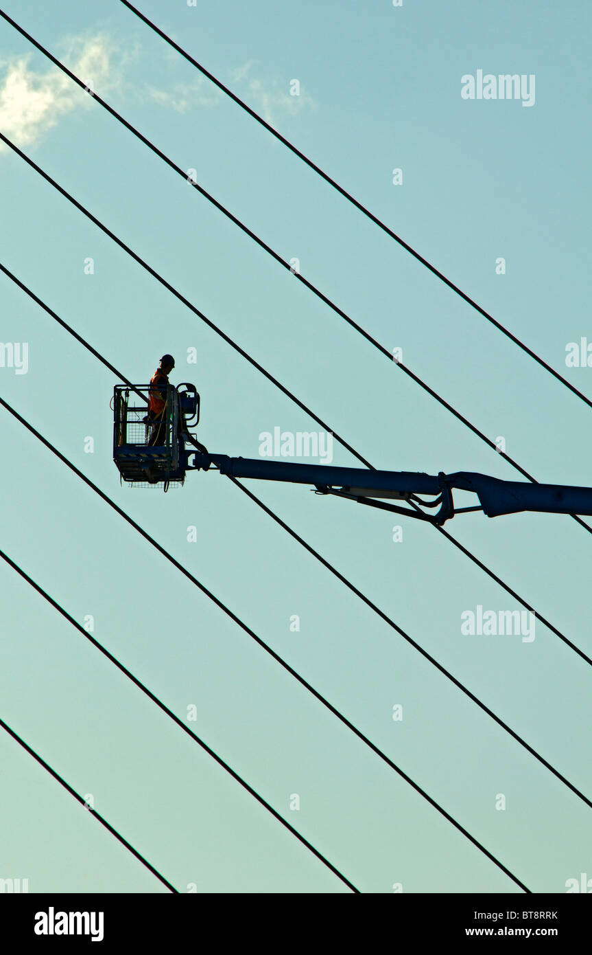 High reach access platform (cherry picker) working on a cable stayed ...