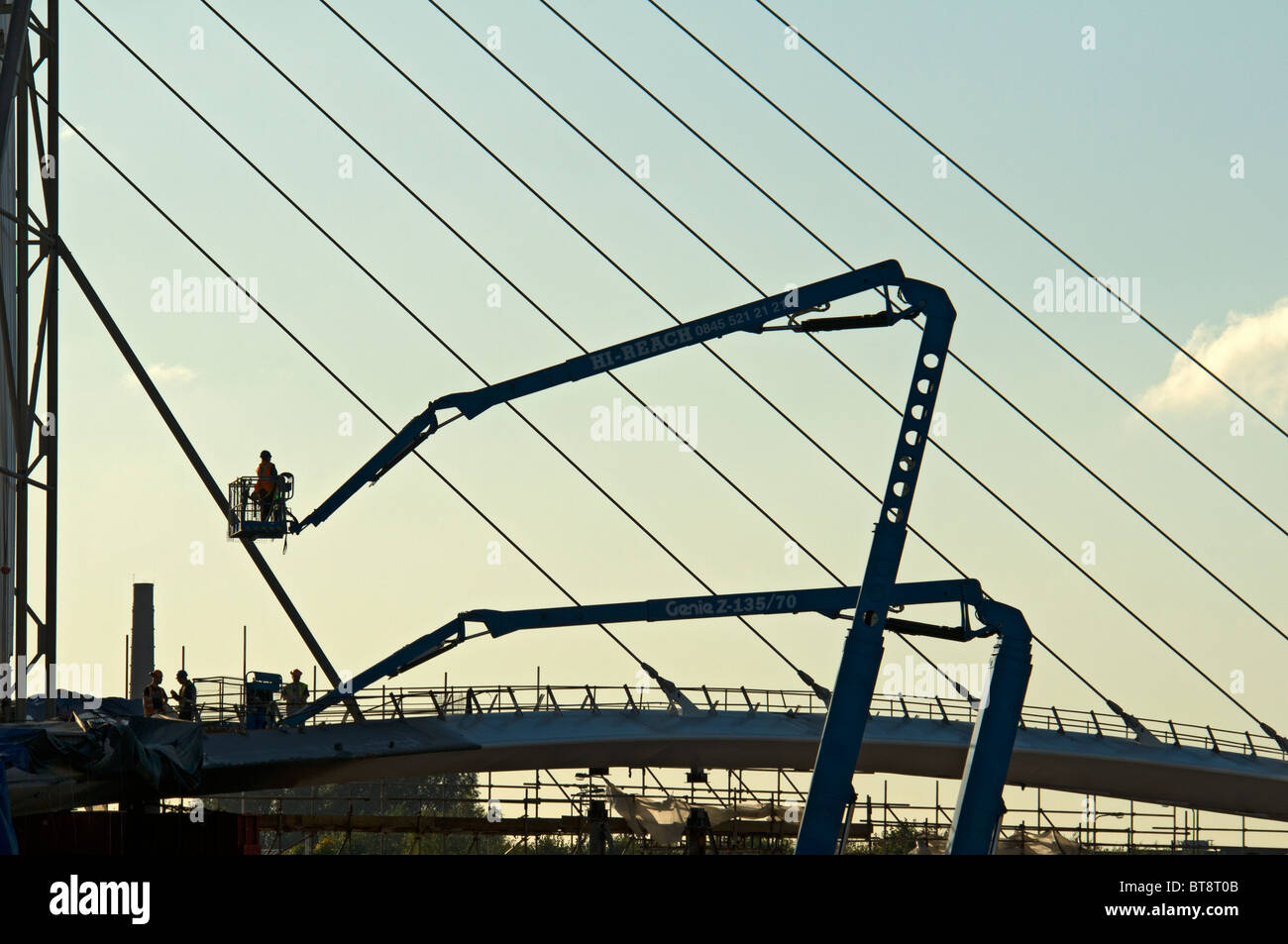 High reach access platform (cherry picker) working on a cable stayed ...
