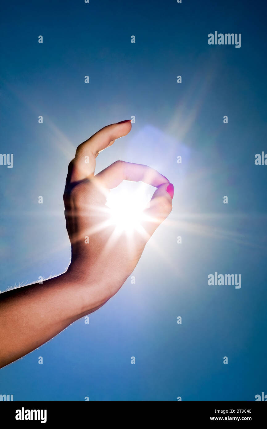 hand and sun Stock Photo - Alamy