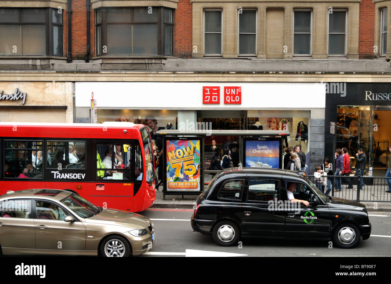 Red bus, bus stop and black cab of London, UK Stock Photo - Alamy