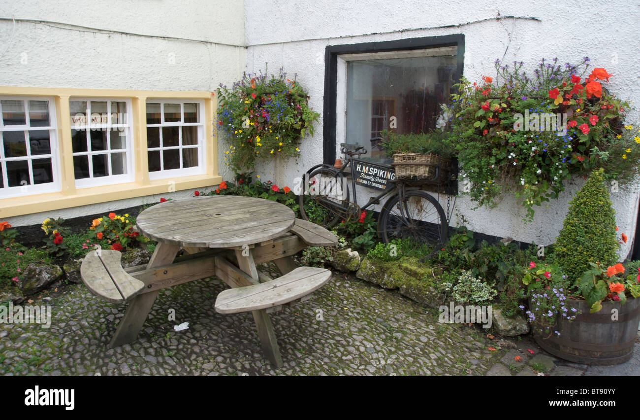 One of the pubs in the Old Village of Cartmel in the lake district in ...