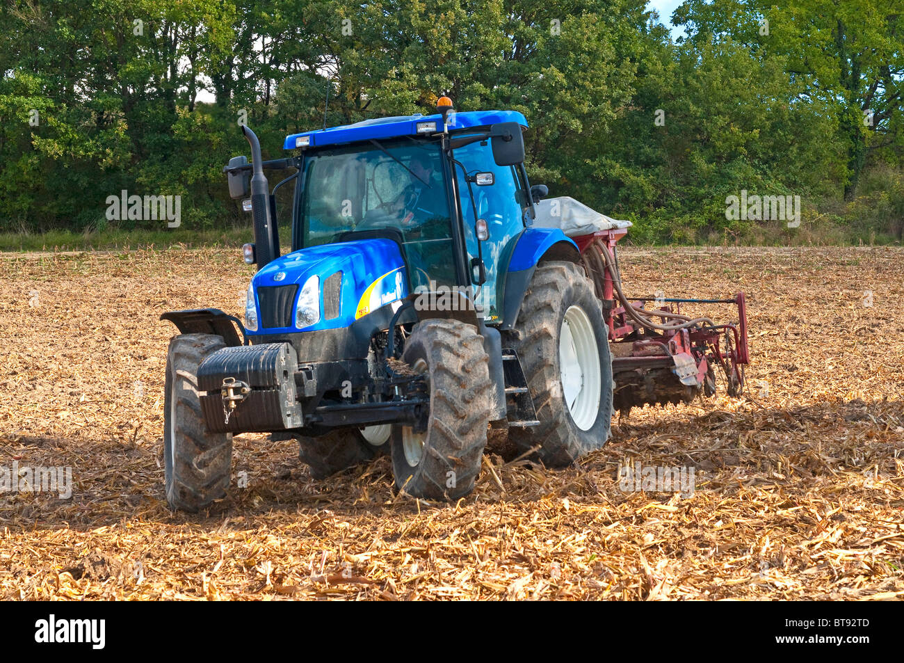 New Holland TS115A tractor with Kuhn seeder sowing winter wheat - sud ...