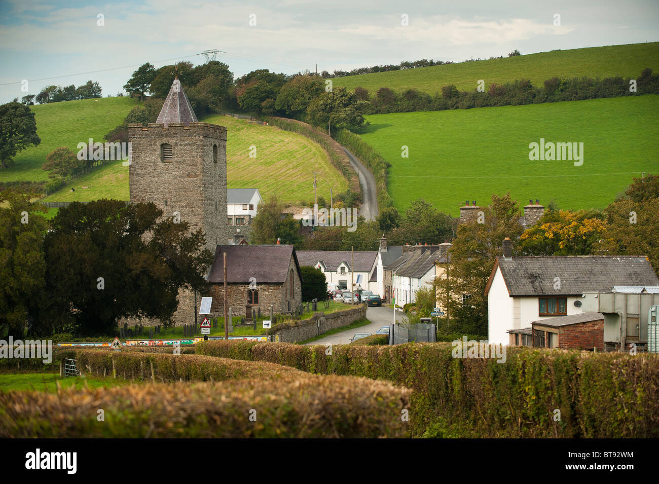 Llanfihangel y Creuddyn village, old church and tower, houses homes, in ...