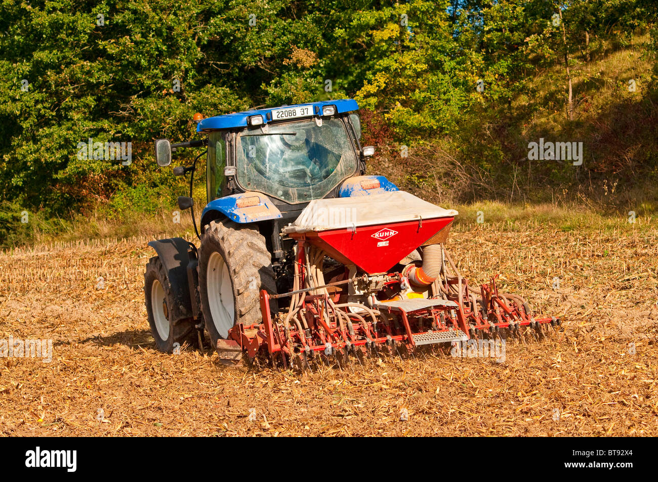 New Holland TS115A tractor with Kuhn seeder sowing winter wheat - sud ...