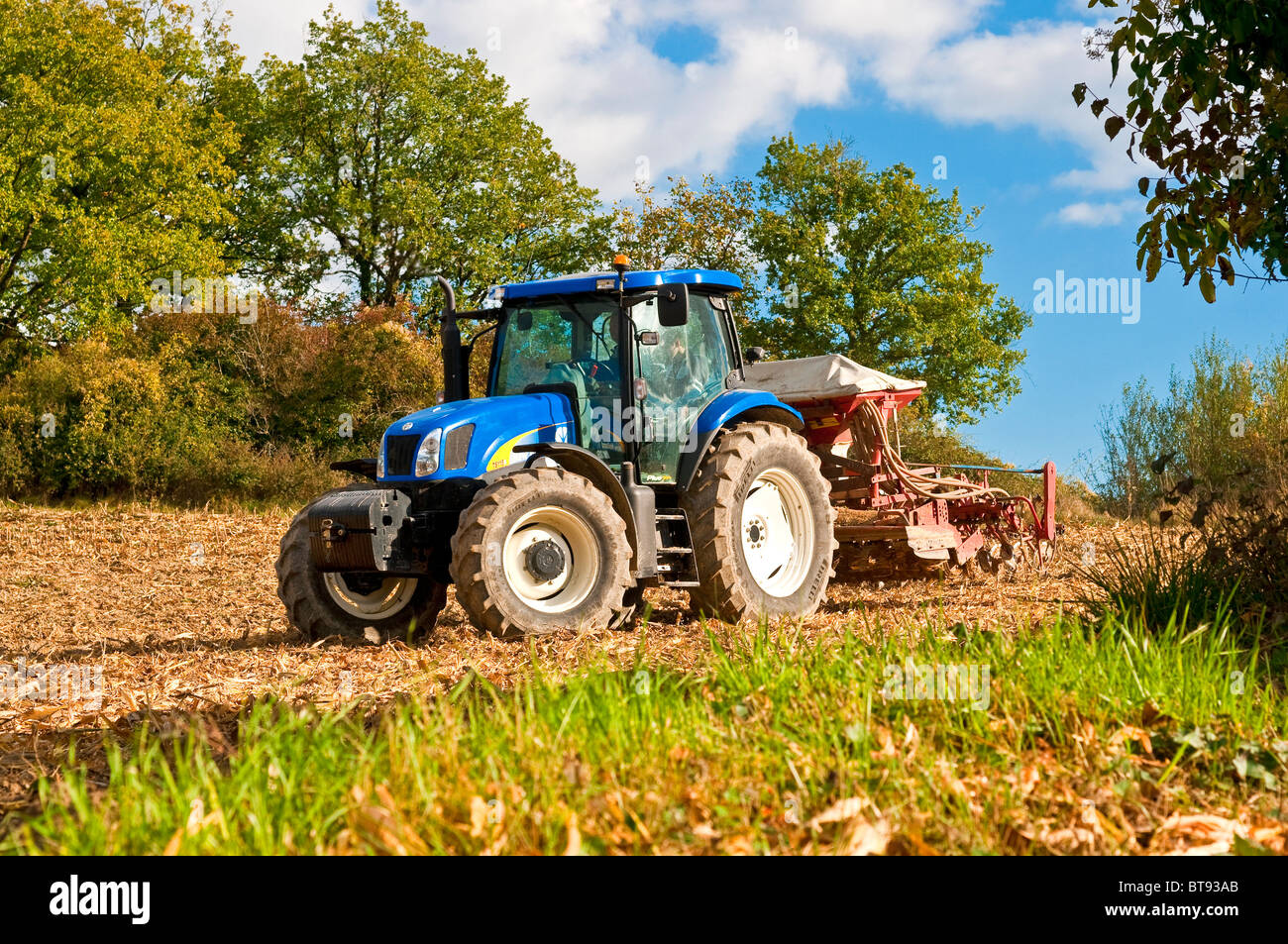 New Holland TS115A tractor with Kuhn seeder sowing winter wheat - sud ...