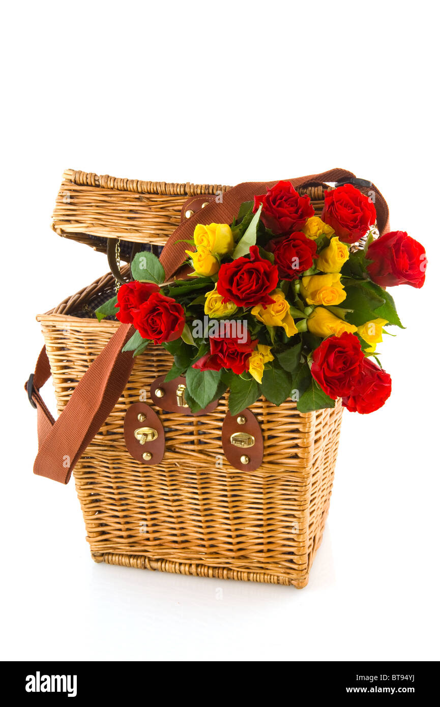 Bouquet red and yellow roses in picnic basket Stock Photo - Alamy