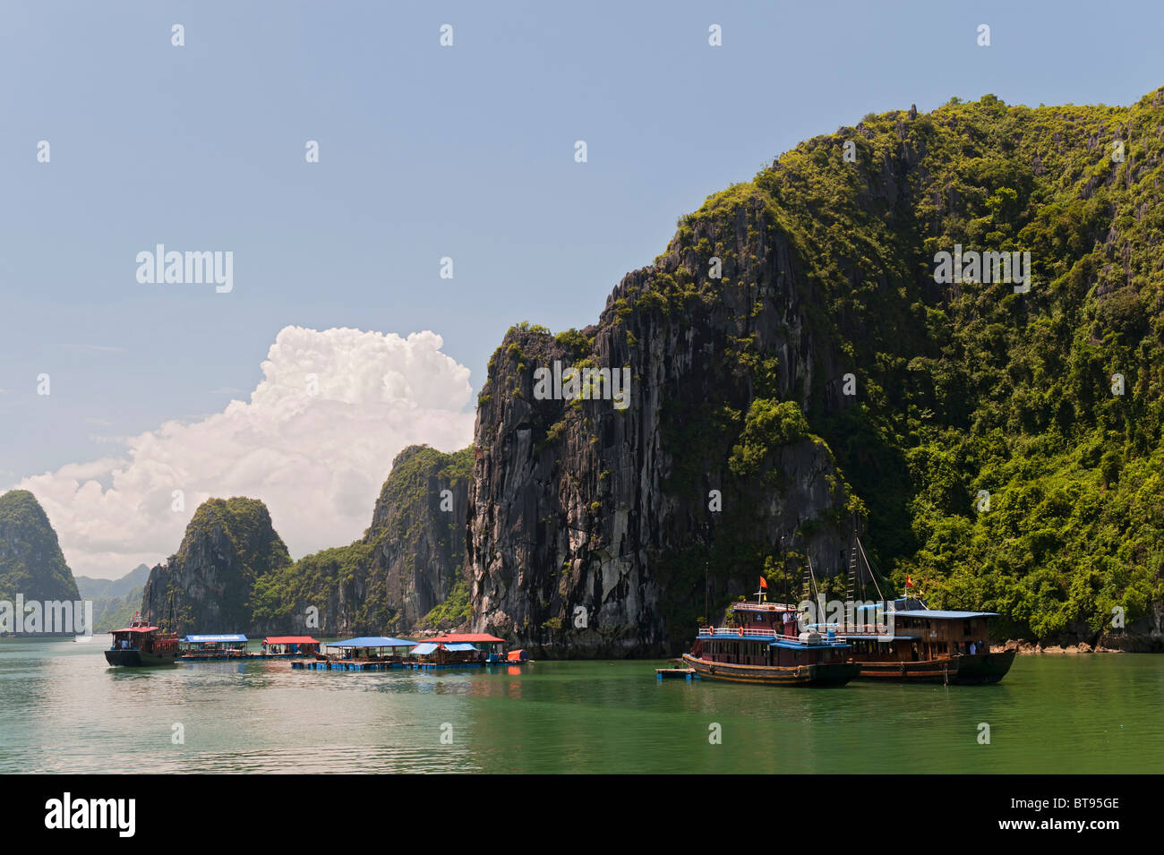 Fishing Village and Junks in Halong Bay, Vietnam Stock Photo - Alamy