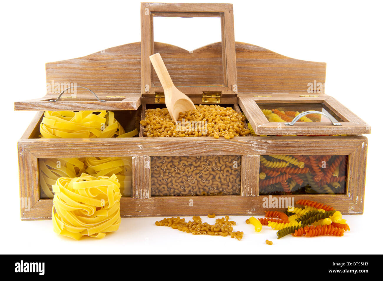 pasta assortment in old wooden shop shelf isolated over white Stock ...