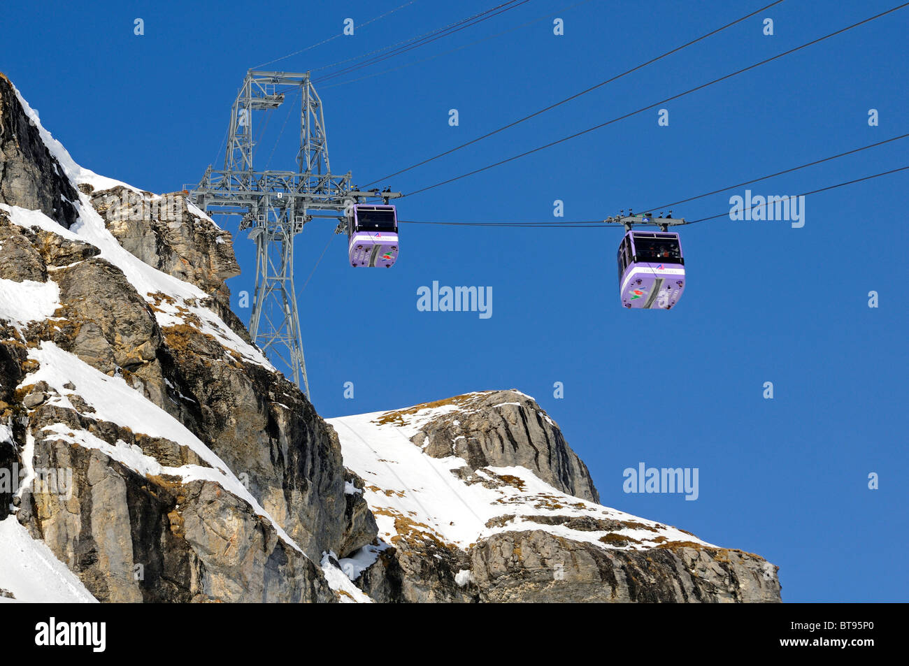 Pylons and passenger cabins of the funitel Plaine Morte in the rocks ...