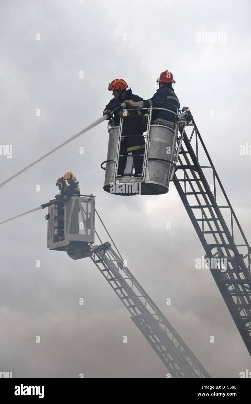 Firefighters on ladders hi-res stock photography and images - Alamy