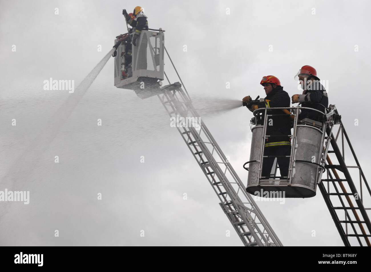 Firefighters on ladders hi-res stock photography and images - Alamy
