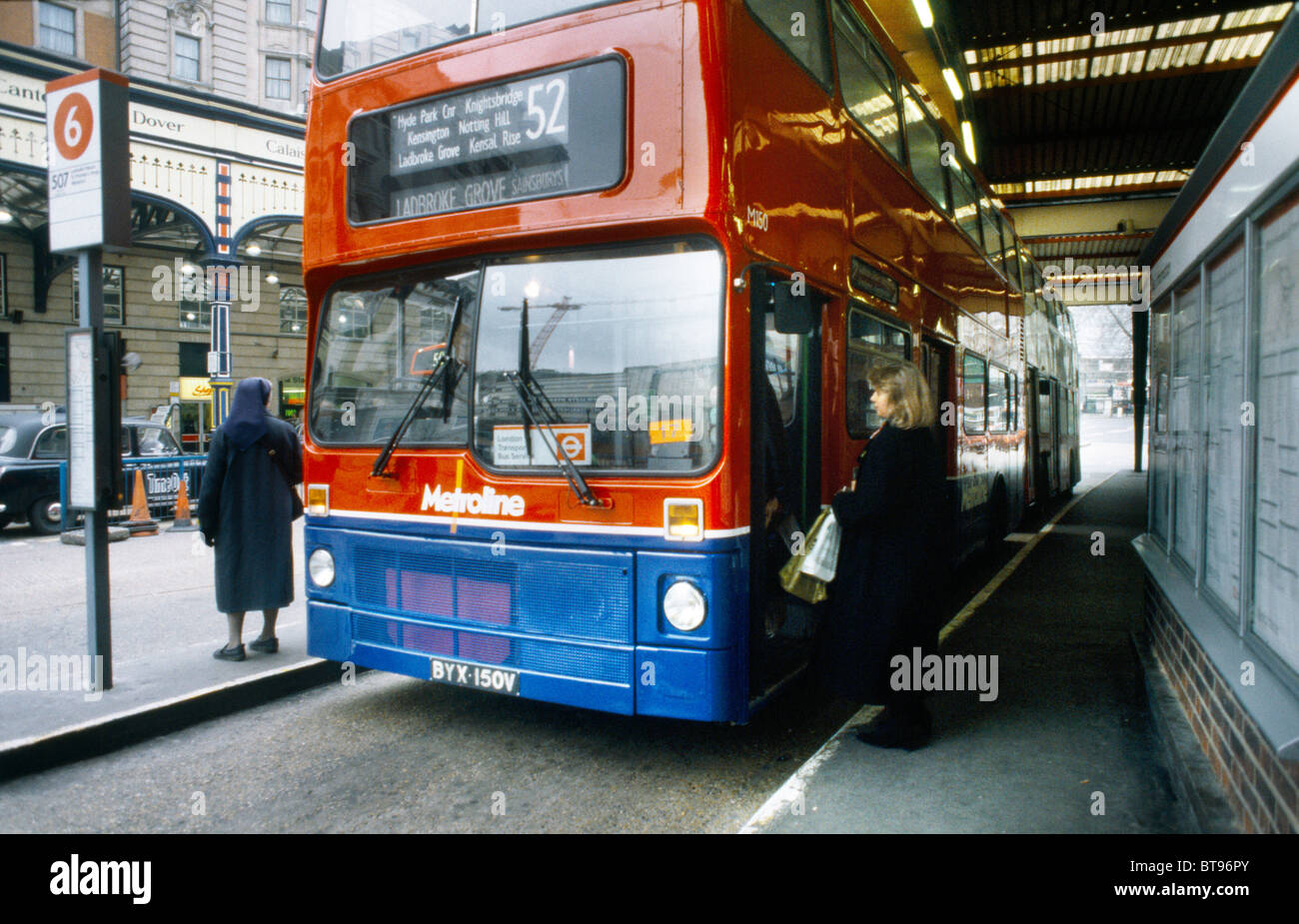 Woman bus stop london hi-res stock photography and images - Alamy