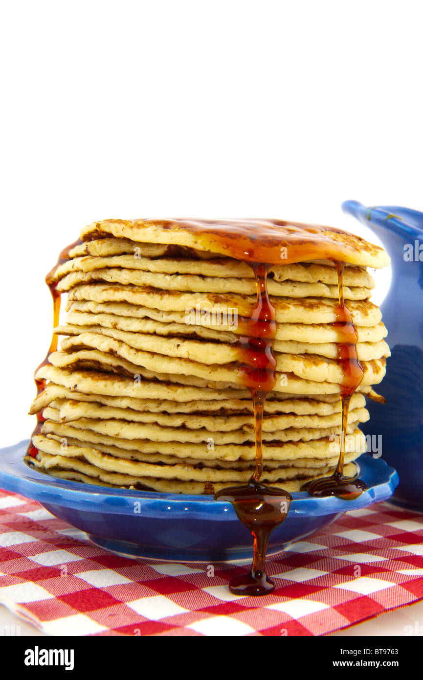 Big stack fresh pancakes with sirop on checkered napkin Stock Photo - Alamy