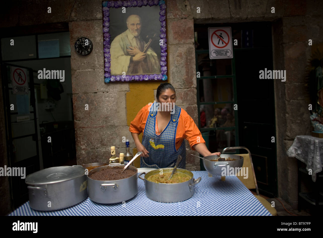 A cook prepares Mexican food in Our Lady of Guadalupe Home for the ...