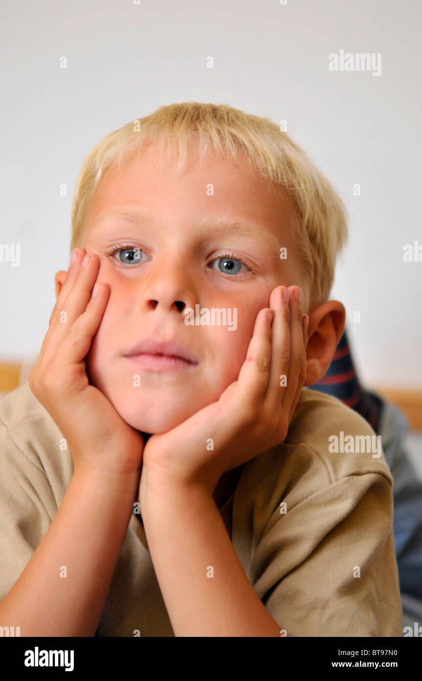 Little boy looking pensive Stock Photo - Alamy