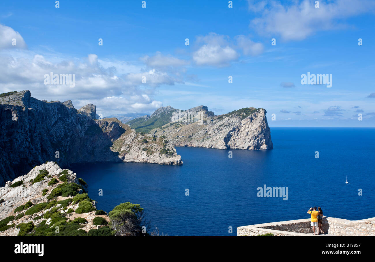 Couple contemplating the landscape. Formentor lighthouse viewpoint ...