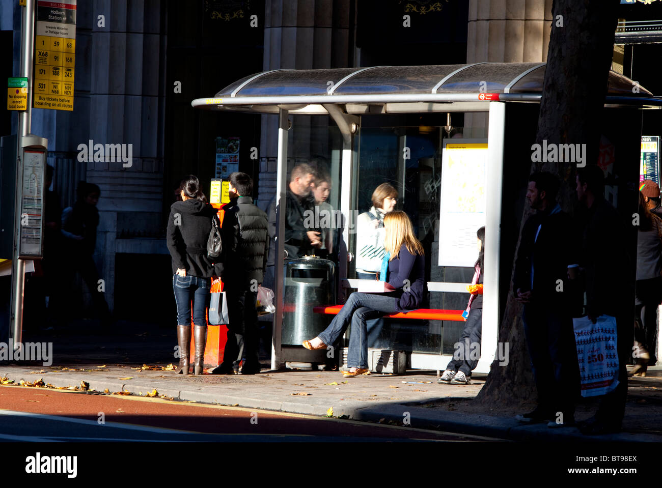 People Waiting At A Bus Stop Stock Photos & People Waiting At A Bus ...