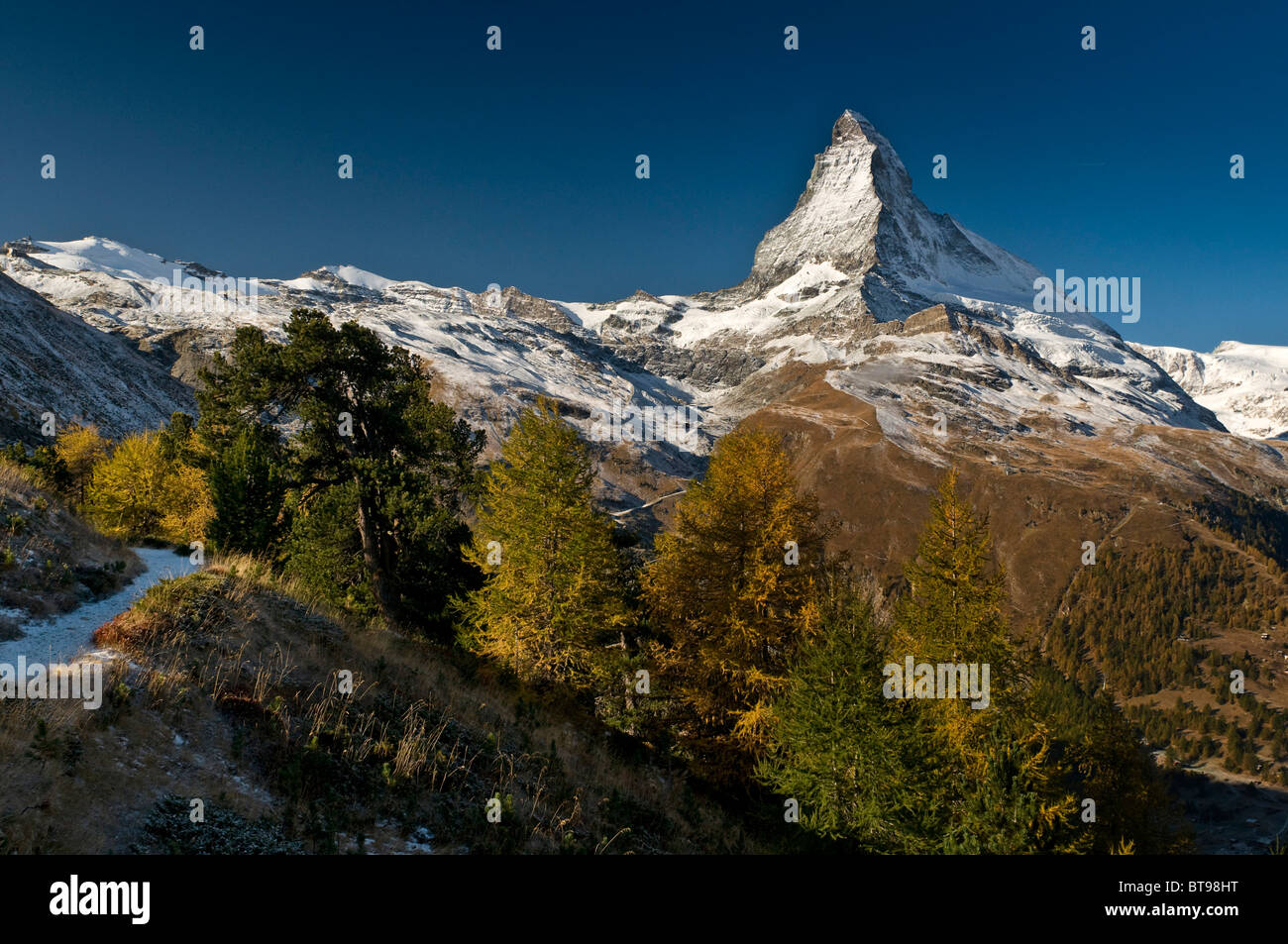 Mt. Matterhorn with autumn-colored larches, Zermatt, Switzerland ...