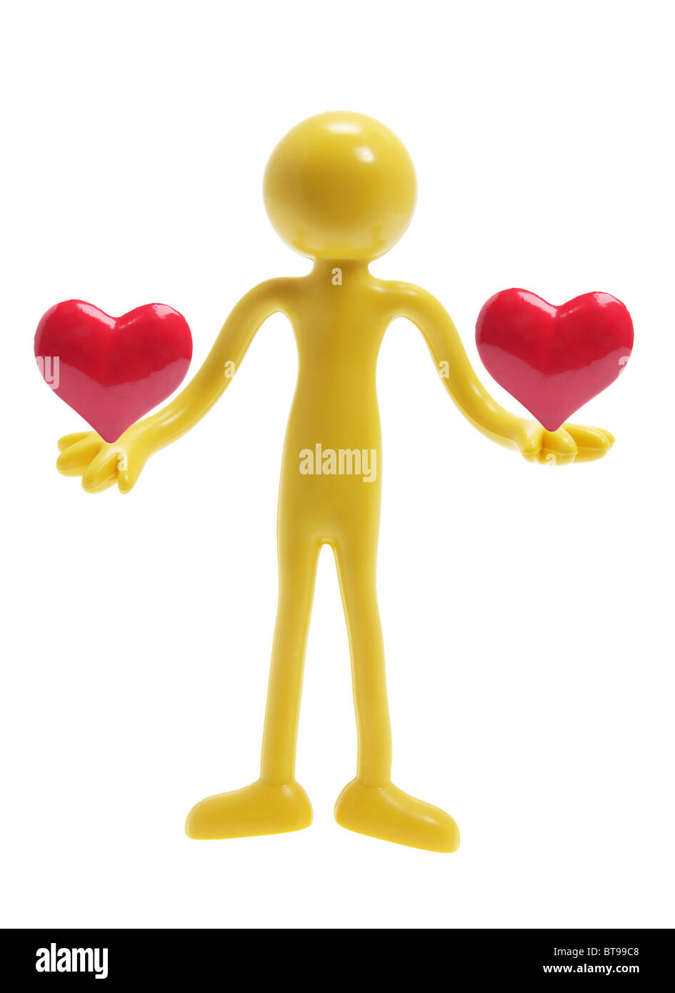 Rubber Figure Holding Love Hearts Stock Photo - Alamy