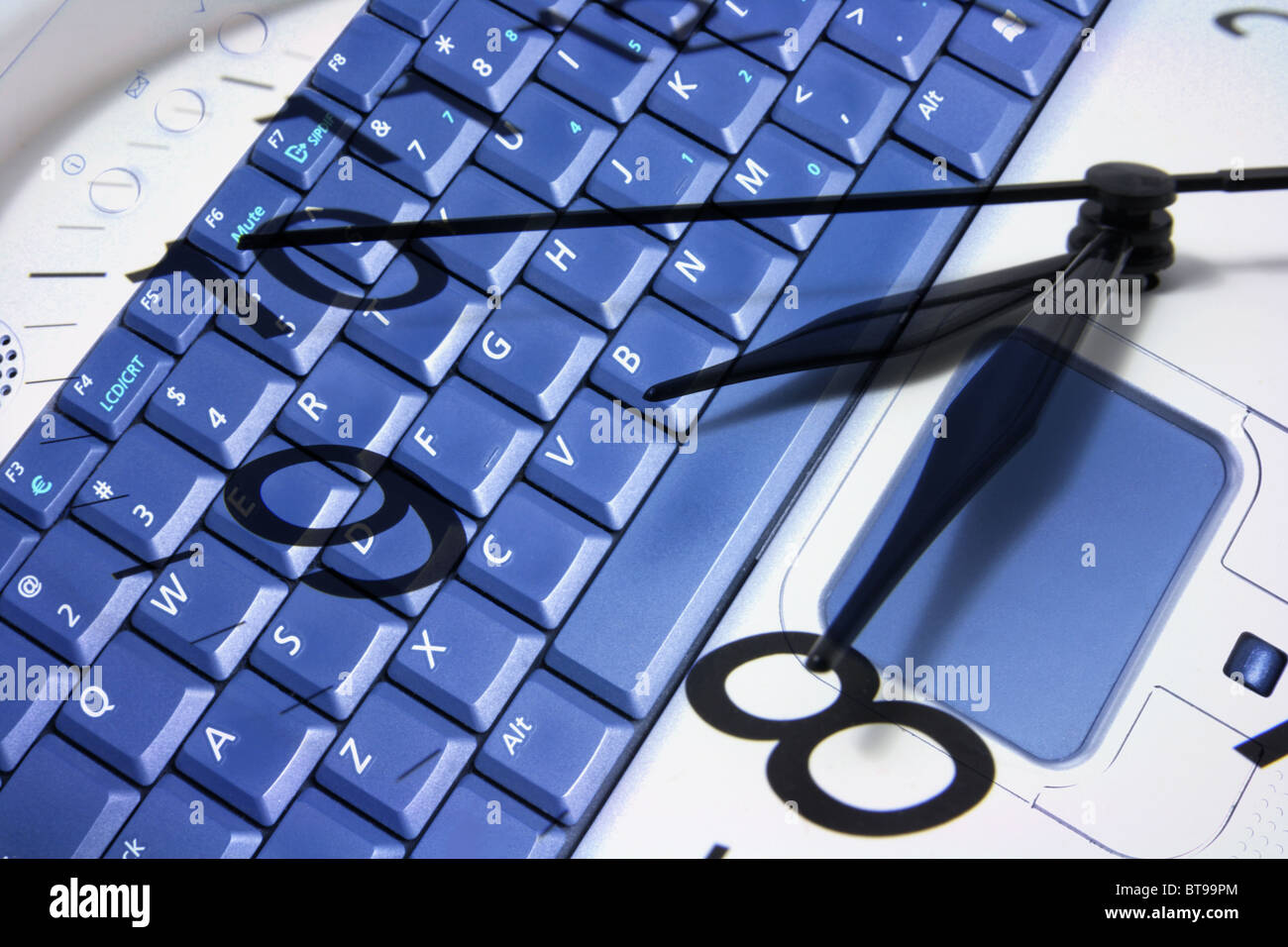 Laptop and Clock Stock Photo - Alamy