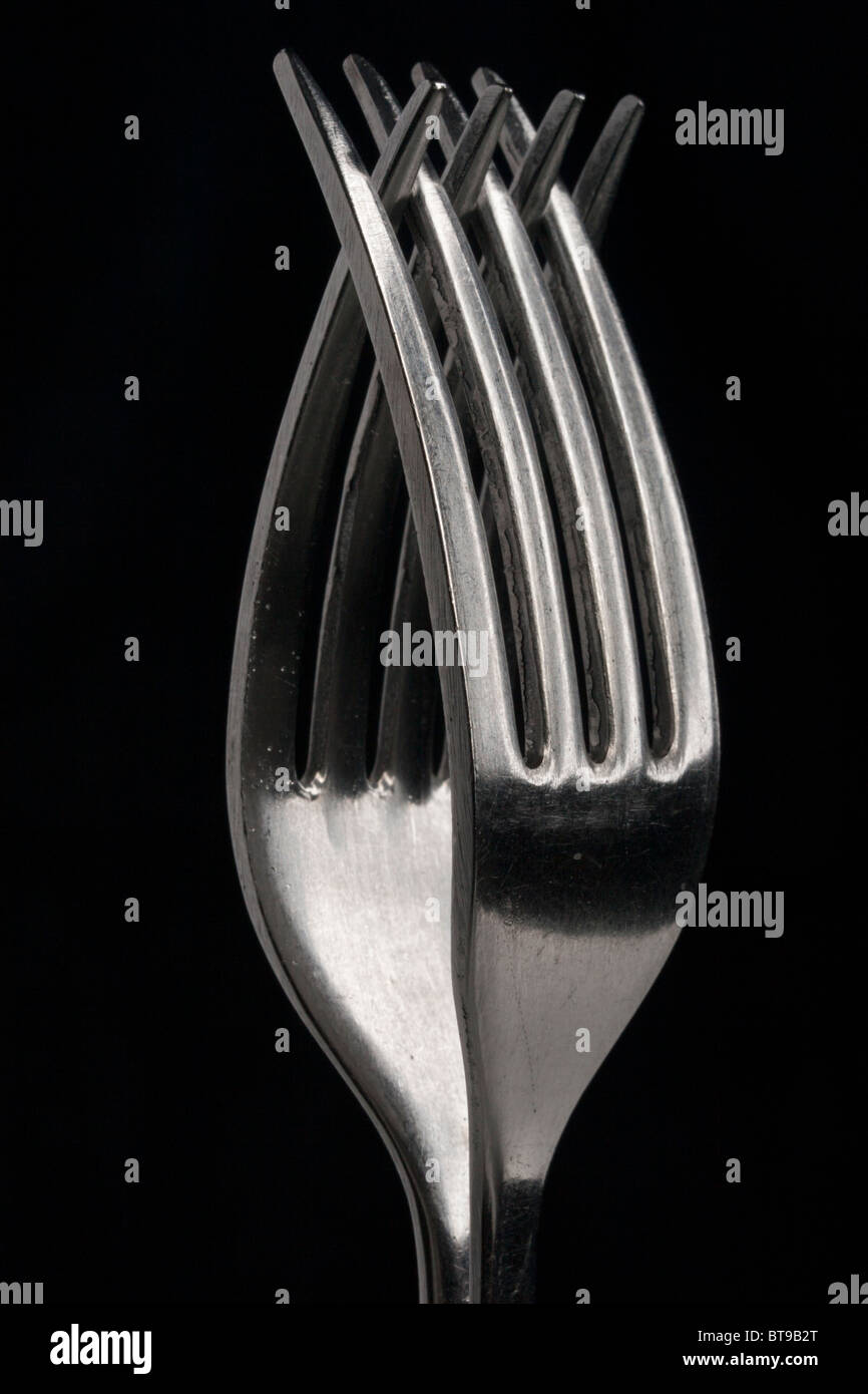 Intertwined forks hi-res stock photography and images - Alamy