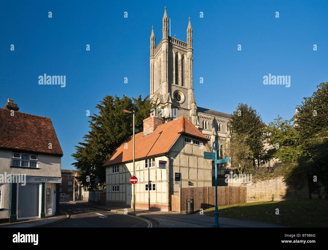 Church of St Mary towers above a restored cottage in Andover Hampshire ...