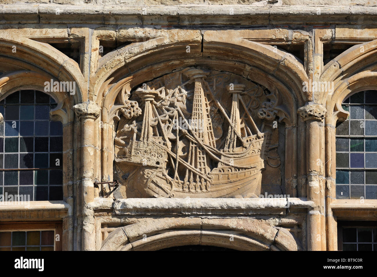 Emblem of ship above door of guildhall at the Grass Lane / Graslei at ...