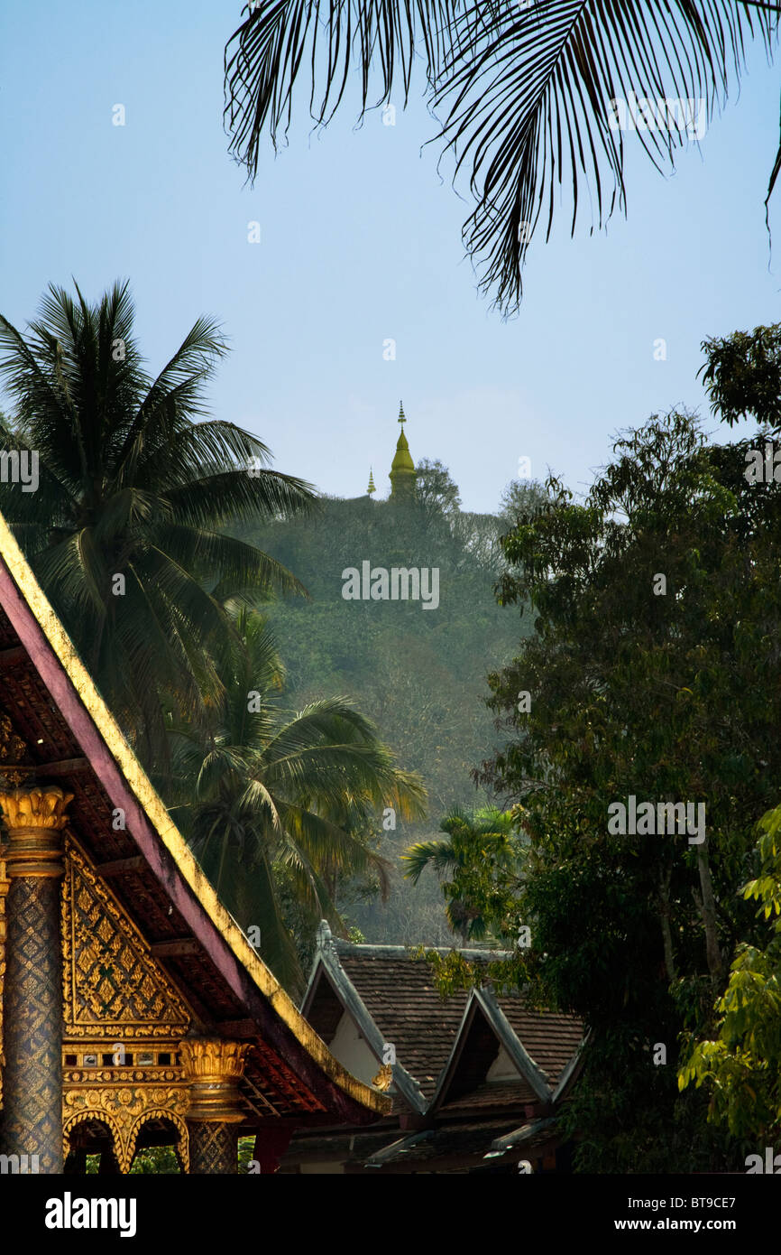 The sacred hill called Phu Si rises at the centre of the quiet city of ...