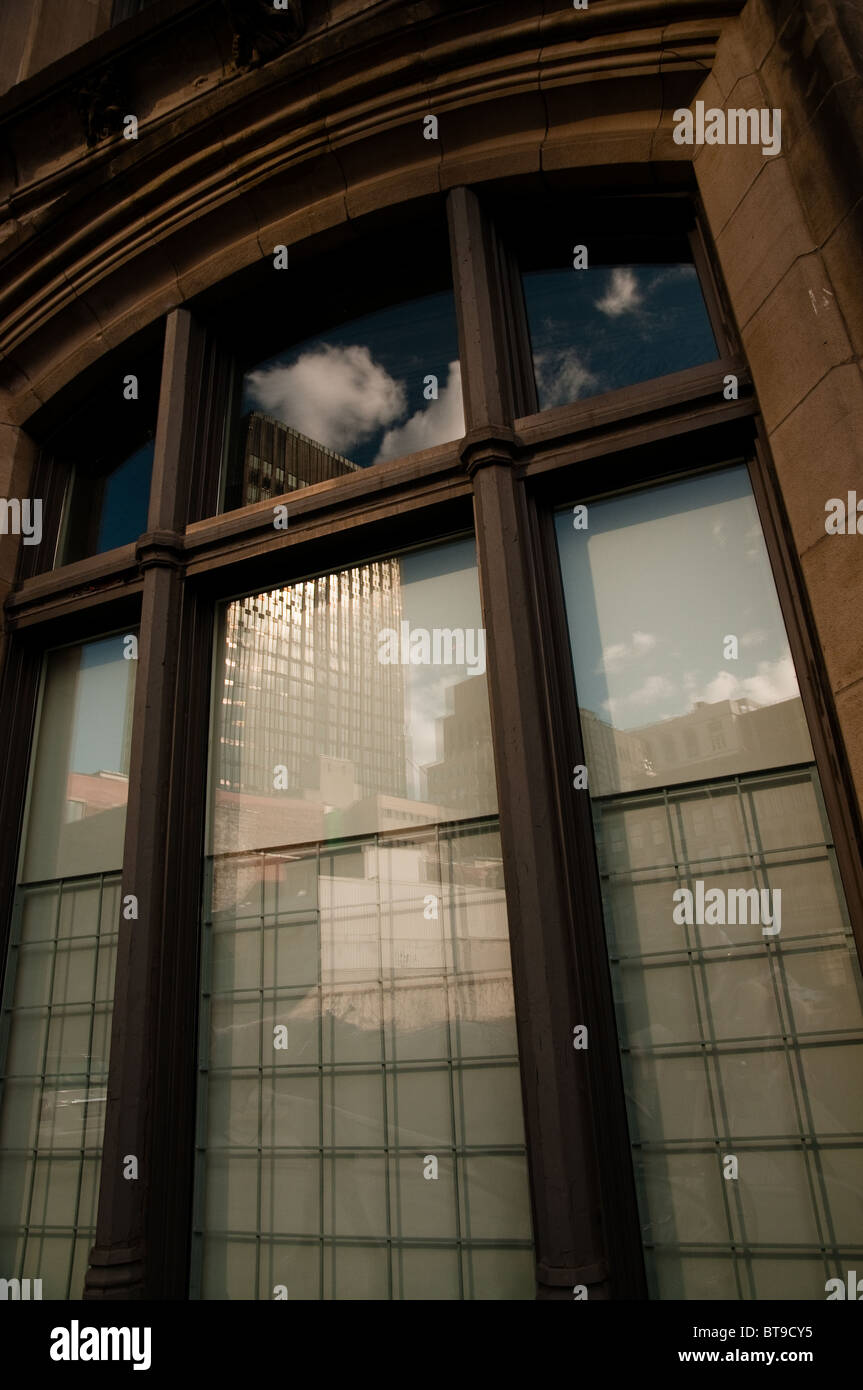 Reflection of a skyscraper in a window, Montreal, Canada Stock Photo ...