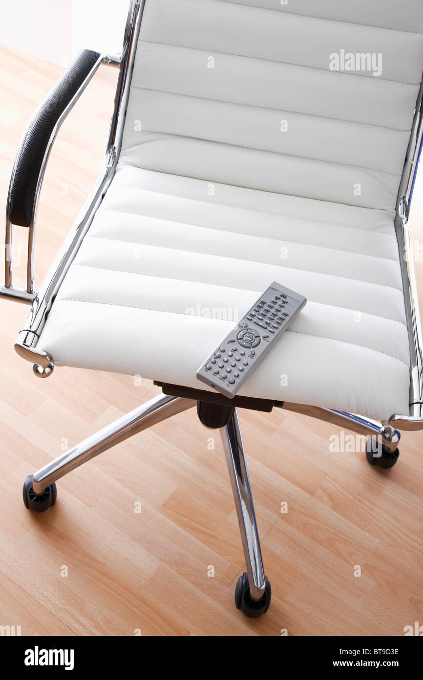 Office chair with a remote control Stock Photo - Alamy
