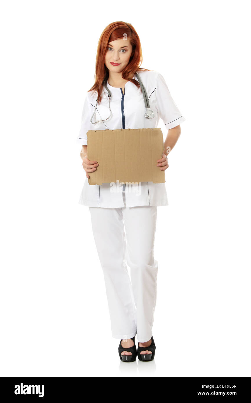 Unemployed female doctor with empty cardboard sign , isolated on white ...
