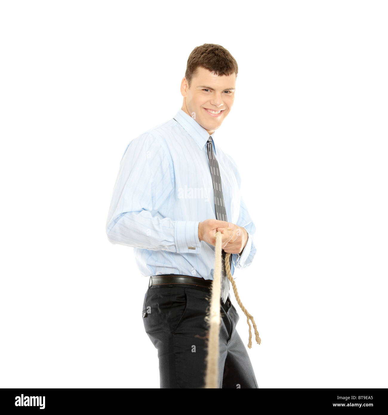 Businessman pulling on a piece of rope. Isolated on white Stock Photo ...