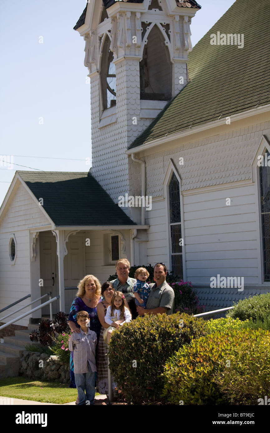 Family attending quaint old church on Easter Sunday Stock Photo - Alamy