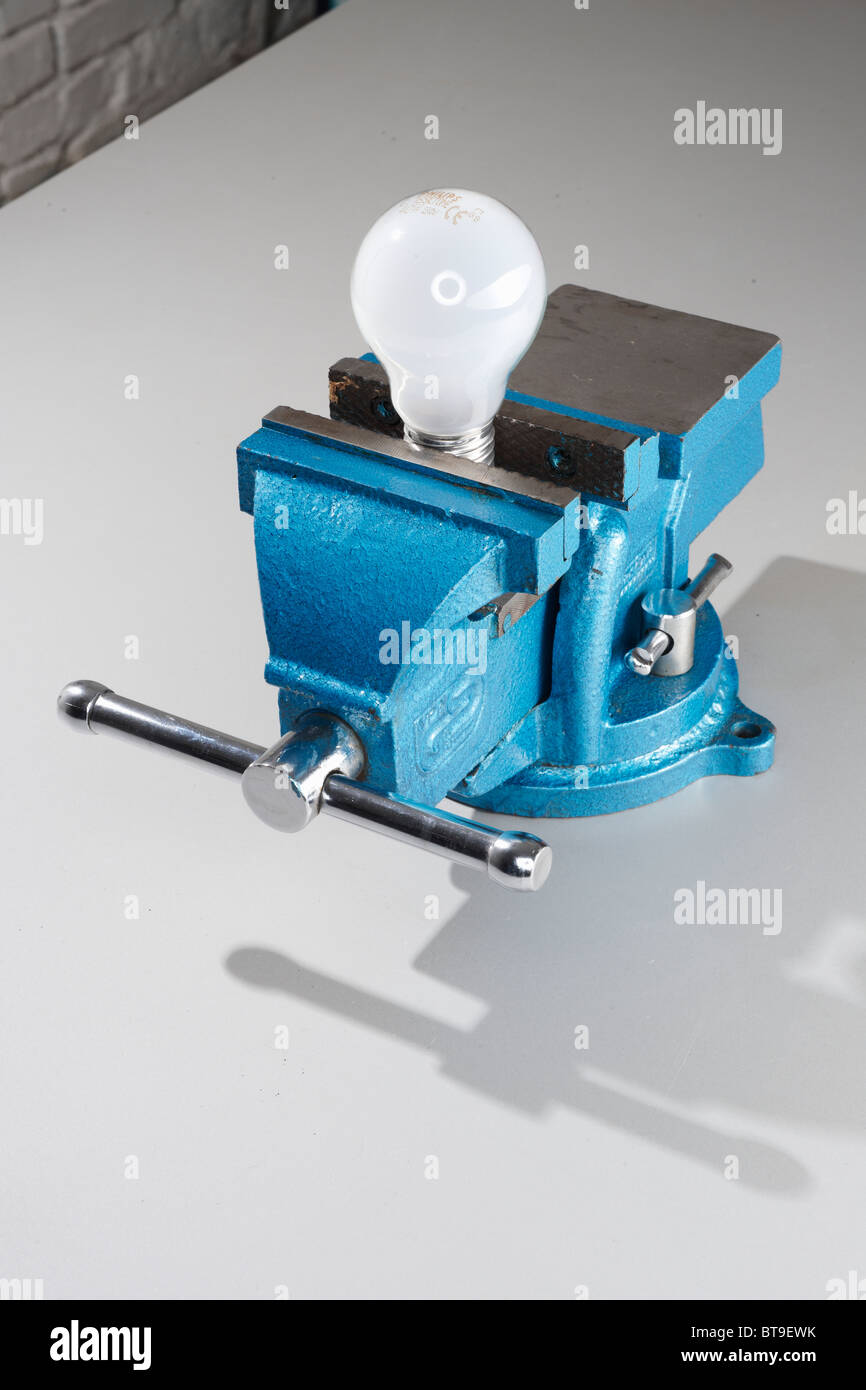 Light bulb in a vice Stock Photo - Alamy