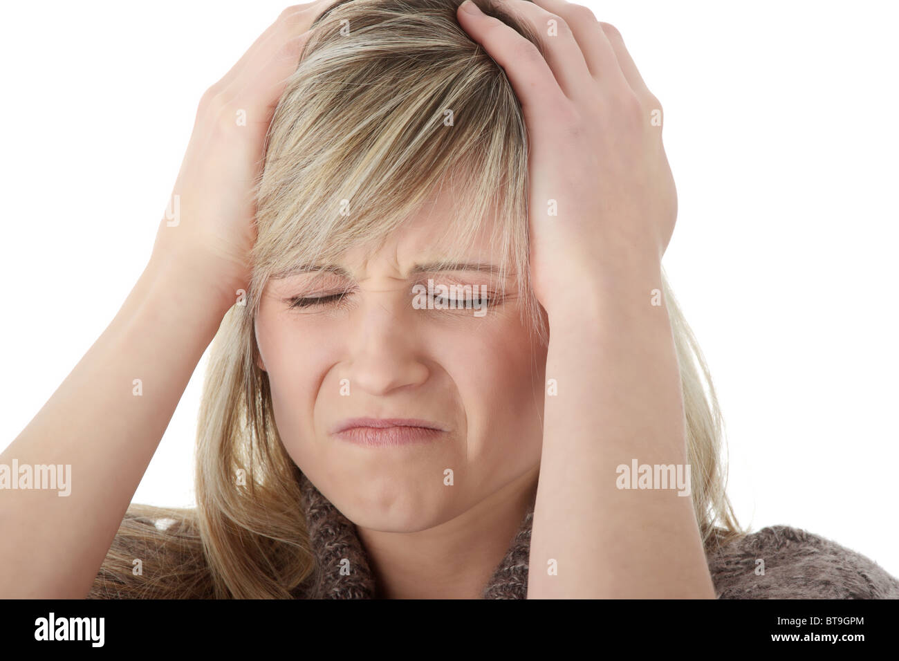 Woman with headache holding her hand to the head, isolated on white ...