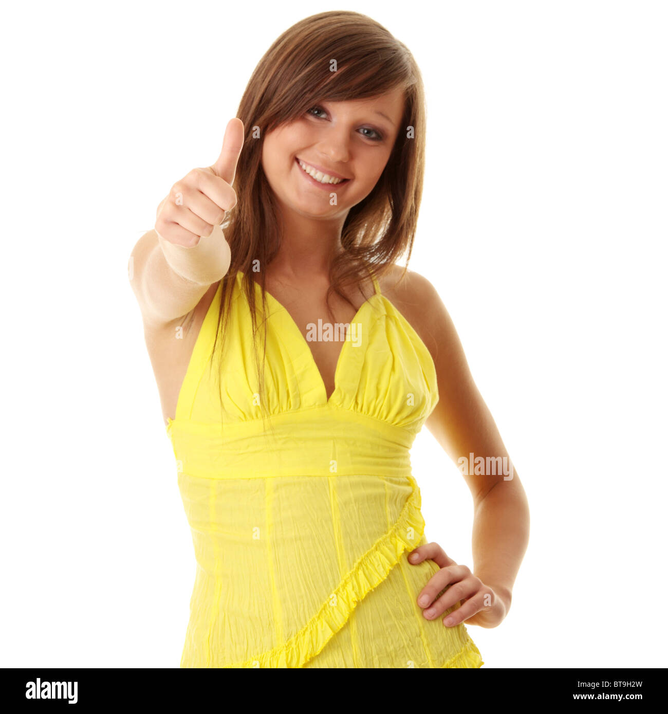 Beautiful brunette girl in yellow dress. Isolated on white background ...