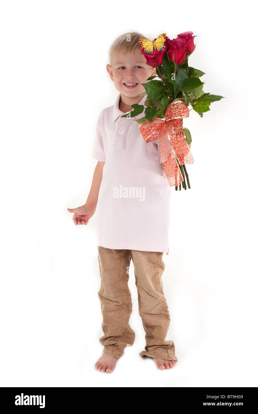 Smiling boy with a bunch of red roses Stock Photo - Alamy