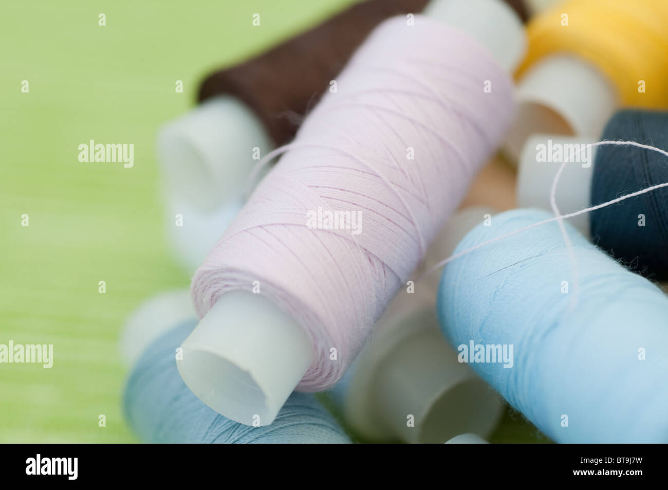Colorful thread reels. small DOF Stock Photo - Alamy