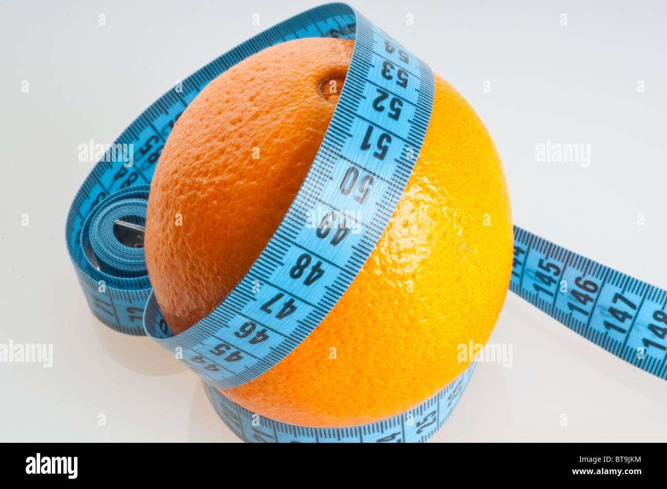 Orange Fruit with measurement isolated on white Stock Photo - Alamy