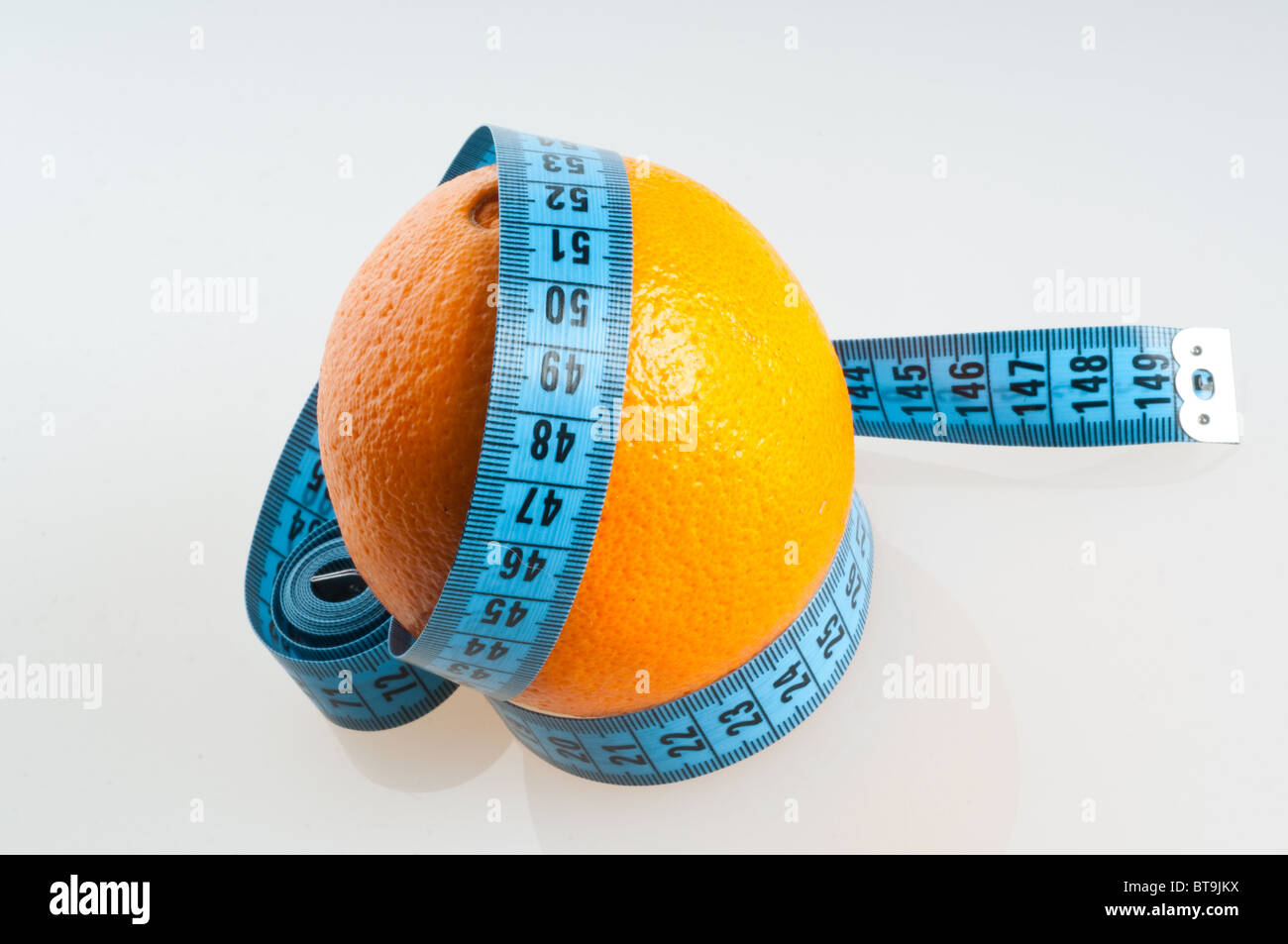 Orange Fruit with measurement isolated on white Stock Photo - Alamy