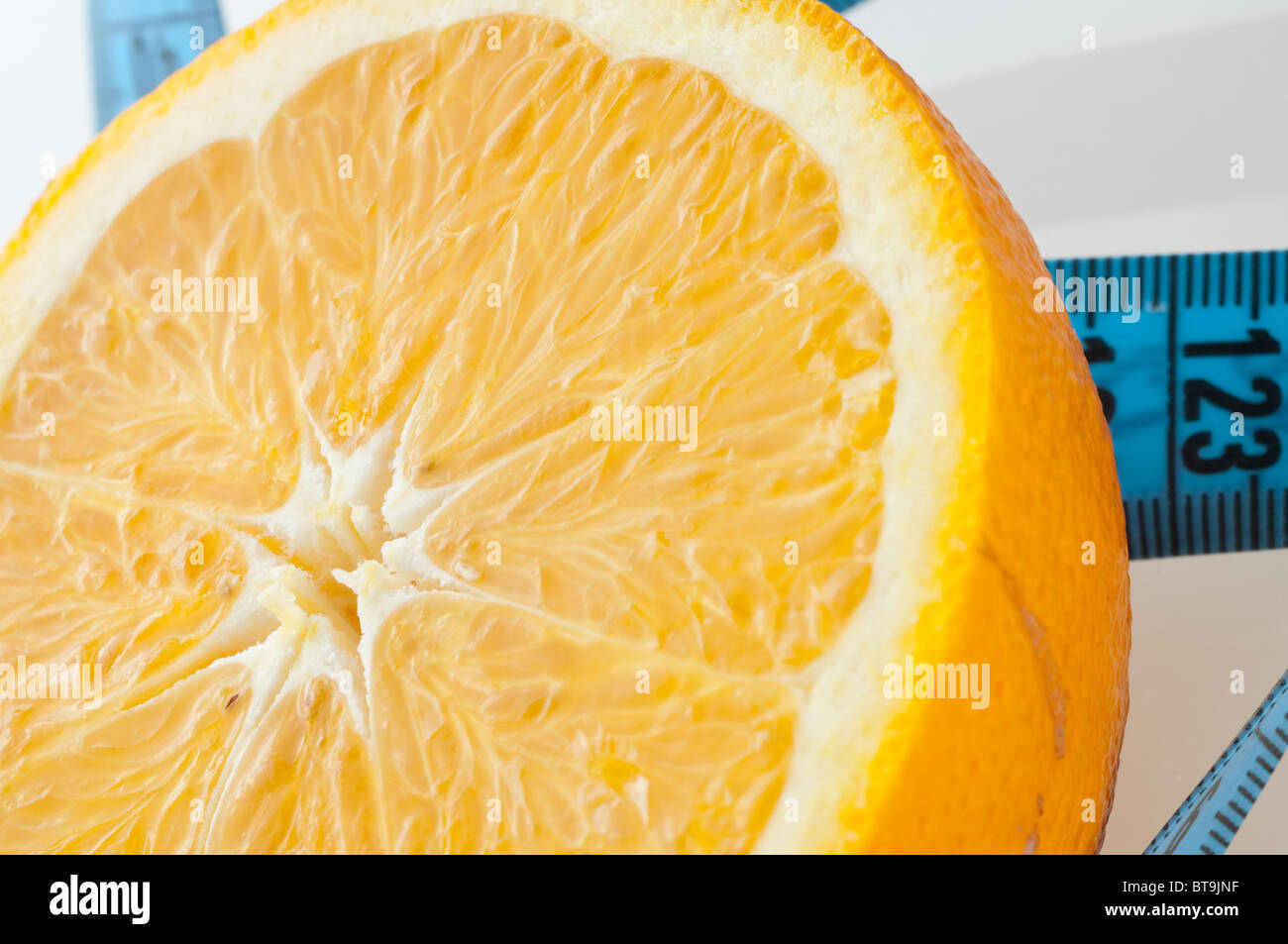 Orange Fruit with measurement isolated on white Stock Photo - Alamy