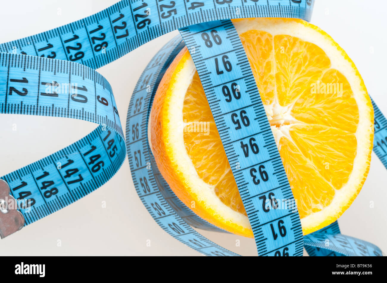 Orange Fruit with measurement isolated on white Stock Photo - Alamy
