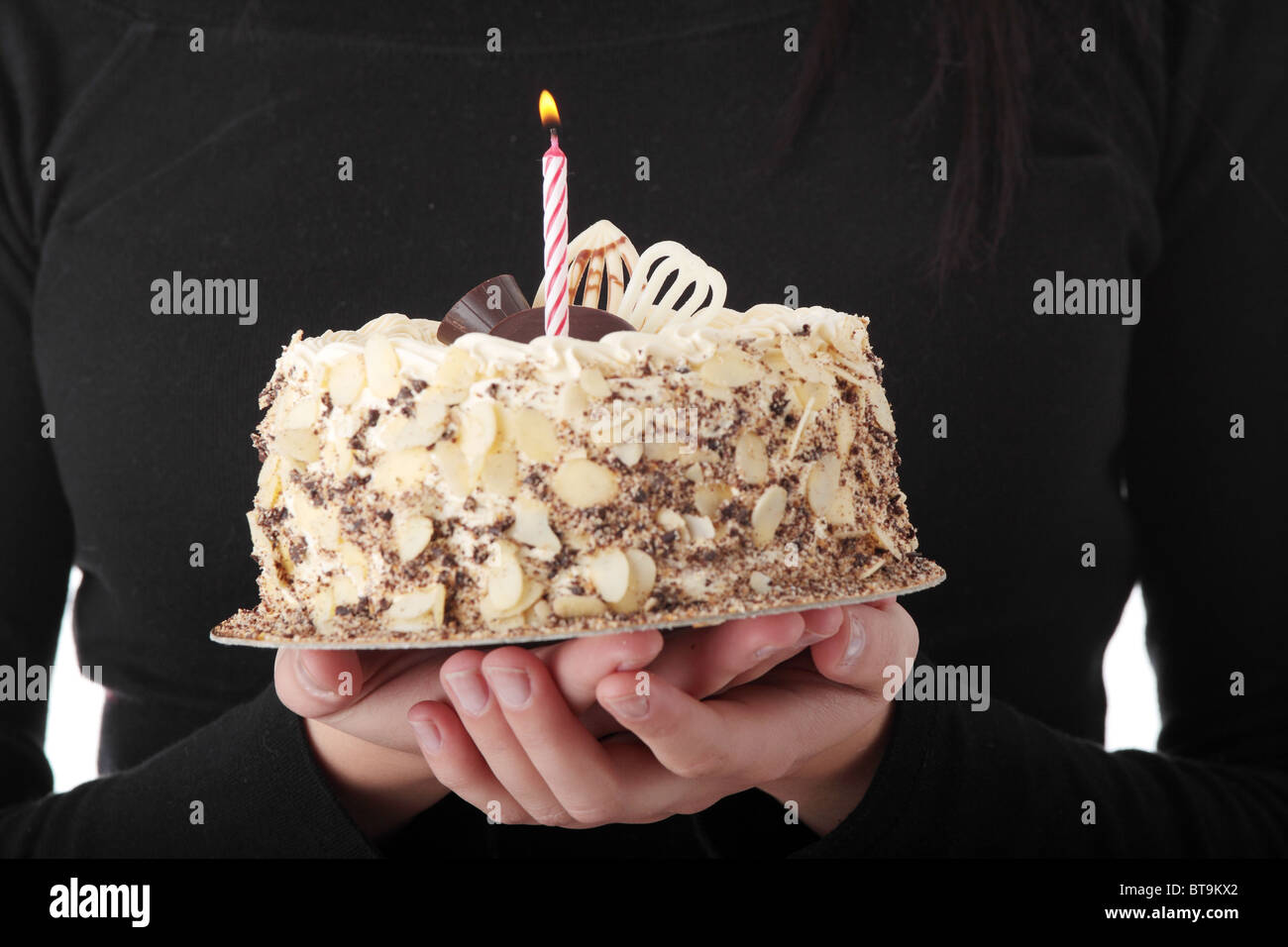 Beautiful young woman with birthday cake isolated on white background ...