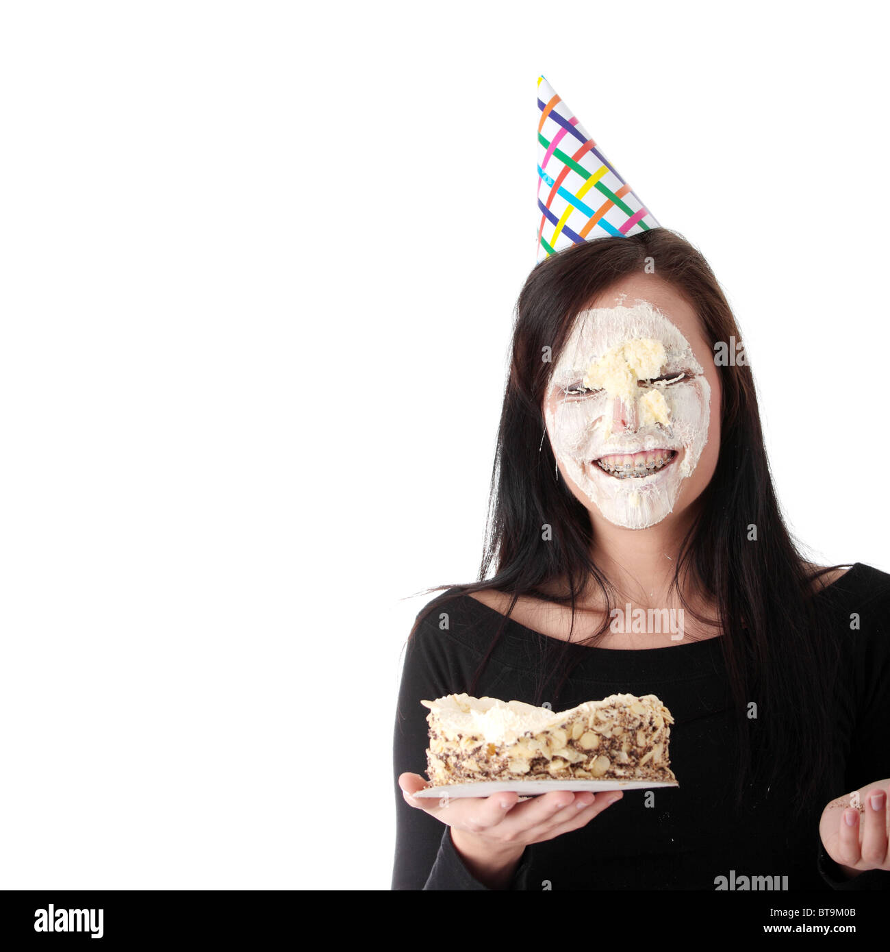 Funny portrait of beautiful young caucasian woman with birthday cake on ...