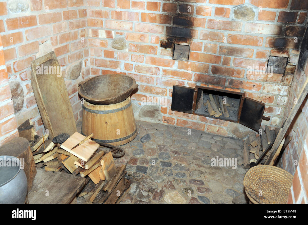 heating furnace in old wooden hut, Masuria region, Poland Stock Photo ...