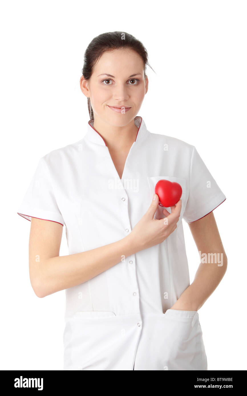 Young nurse with heart in her hand, isolated on white background Stock ...