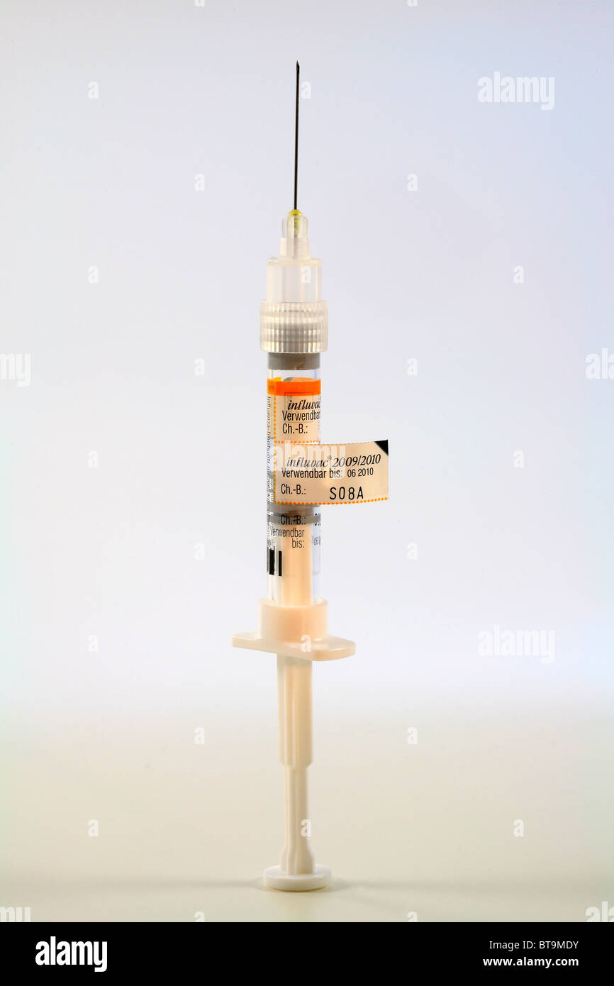 Syringe with vaccine for vaccination against the influenza flu virus ...