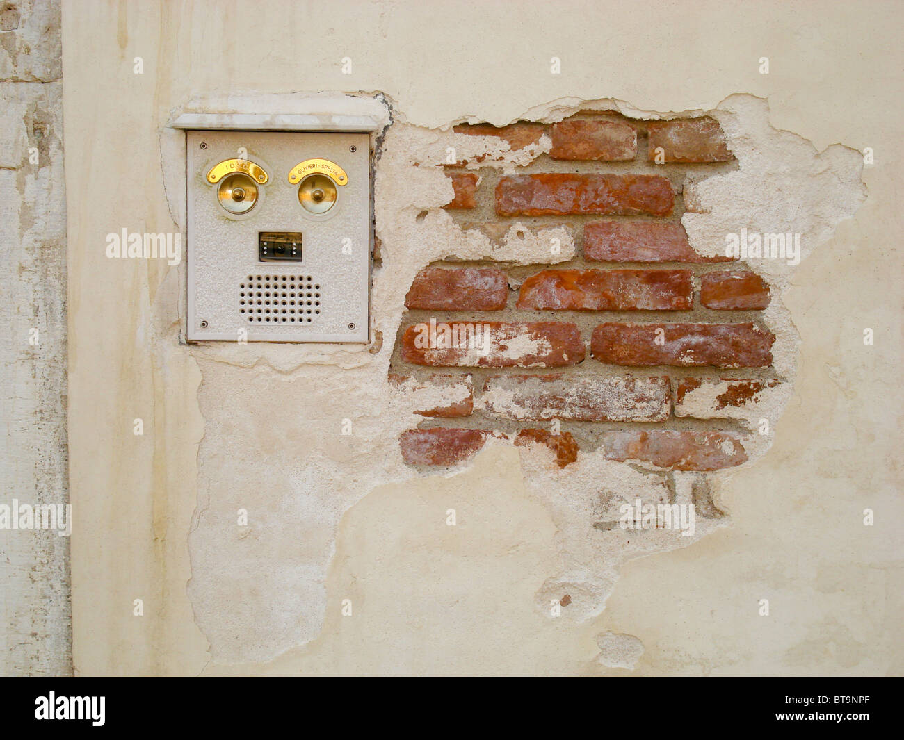 Architectural detail, patch of exposed bricks next to entrance with ...
