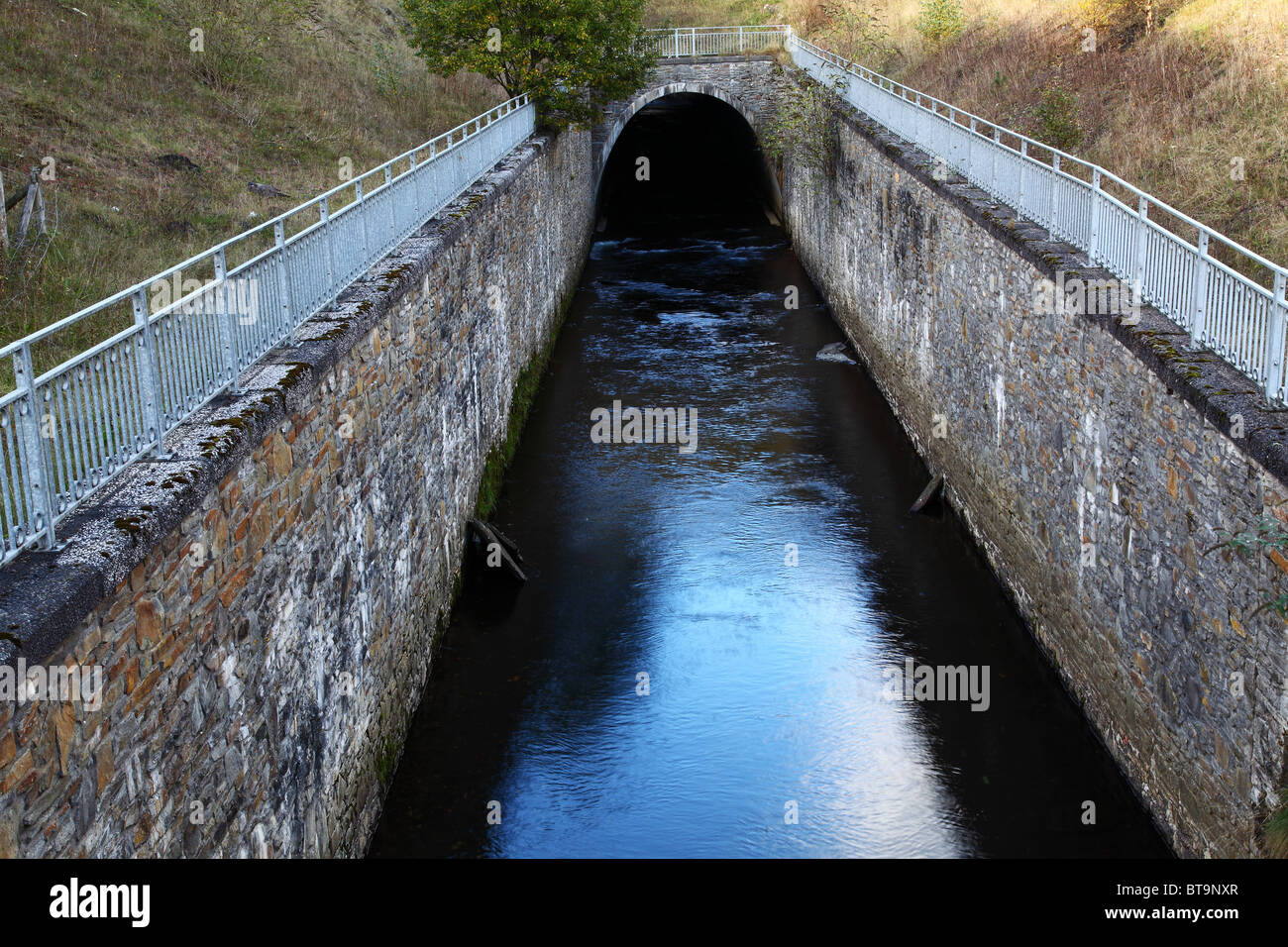 The Rhymney river flowing thought a tunnel at Bargoed in South Wales ...