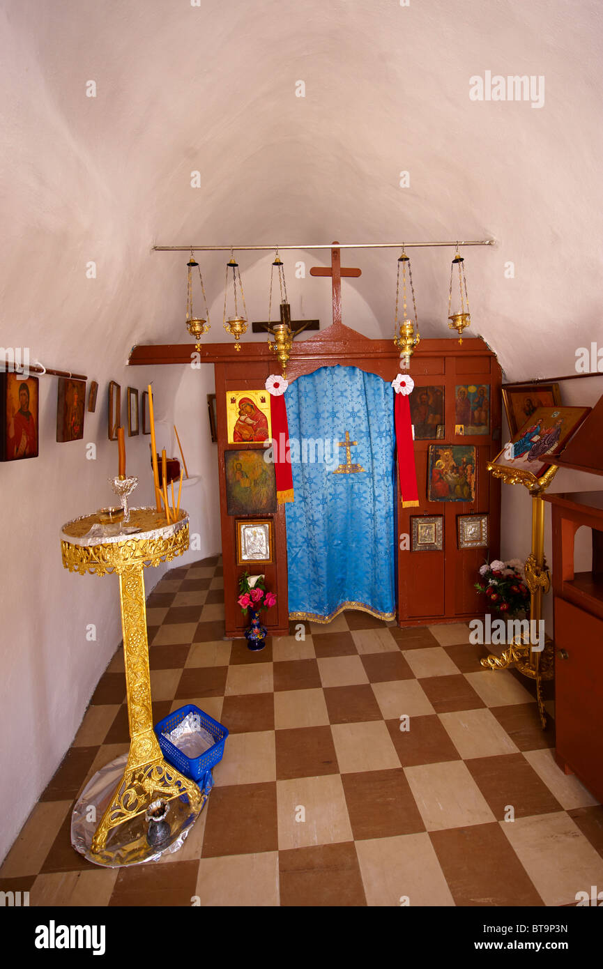 Interior of one of the 365 Greek Orthodox Chapels of Ios with religious ...